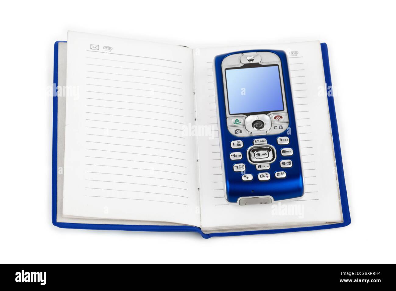 Mobile phone on book Stock Photo - Alamy
