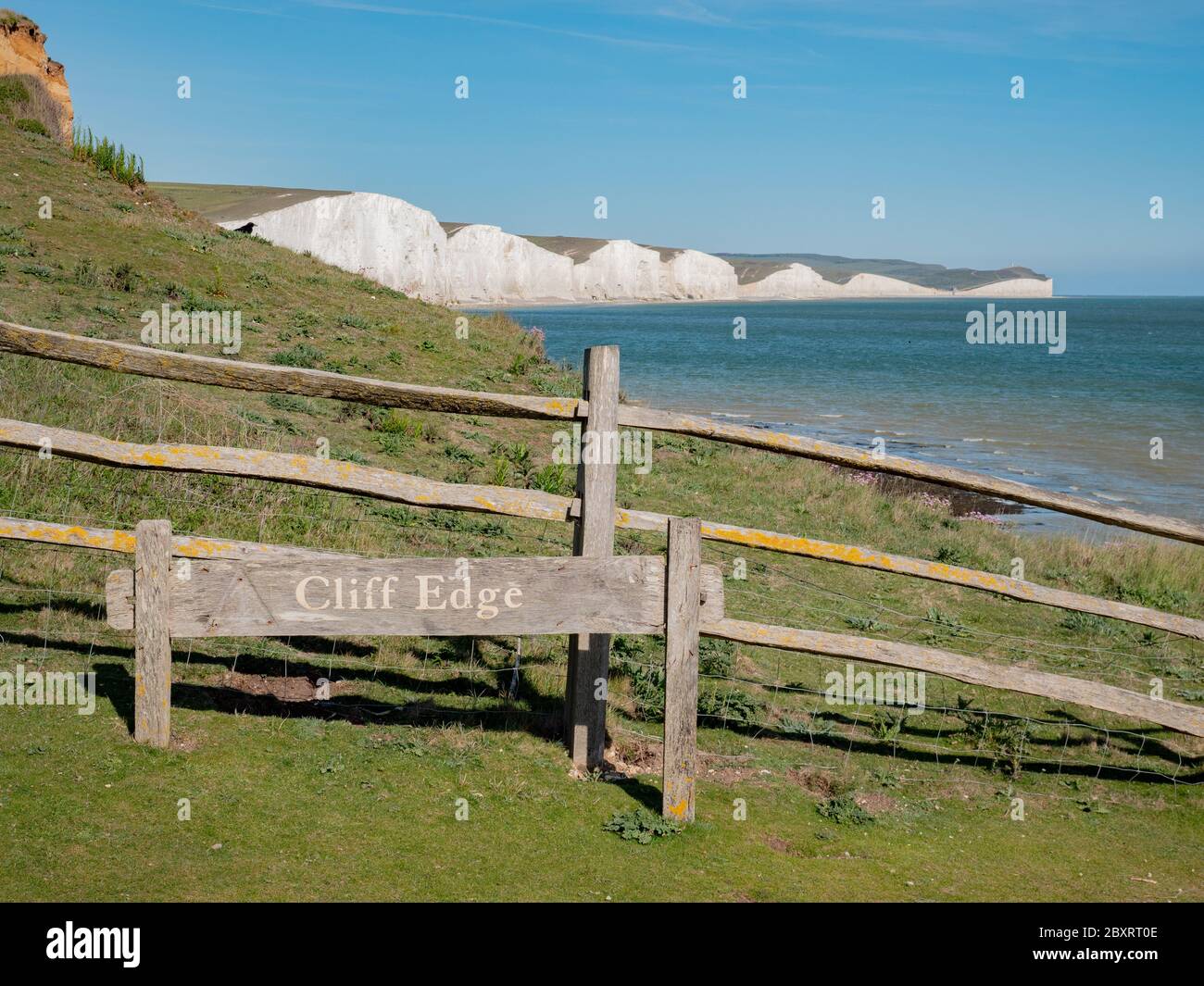 Seven Sisters cliffs, East Sussex, England. A 'Cliff Edge' warning sign ...