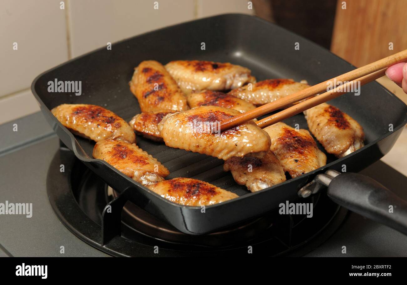 Man eating chicken wings hi-res stock photography and images - Alamy