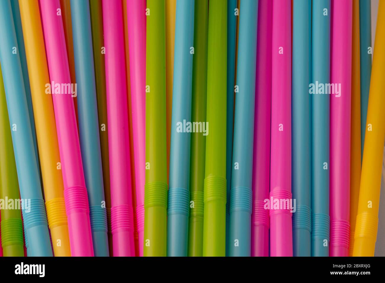 Straw plastic colorful background for drinking water Stock Photo - Alamy