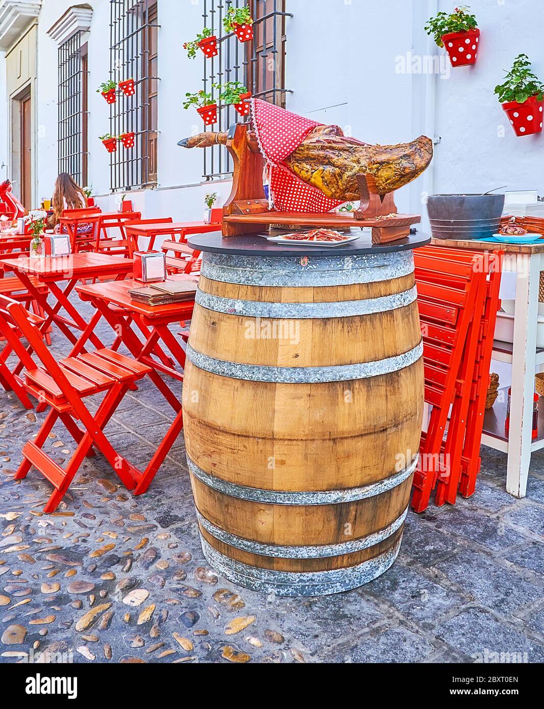 Jamon leg on the old cask attracts people to taste delicious Spanish ...