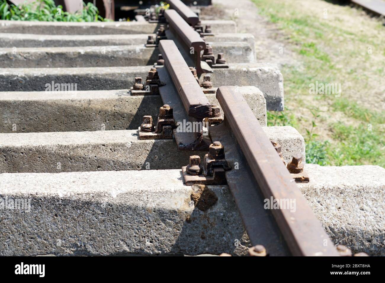 Hardened steel railroad tracks photographed on a sunny spring day Stock ...
