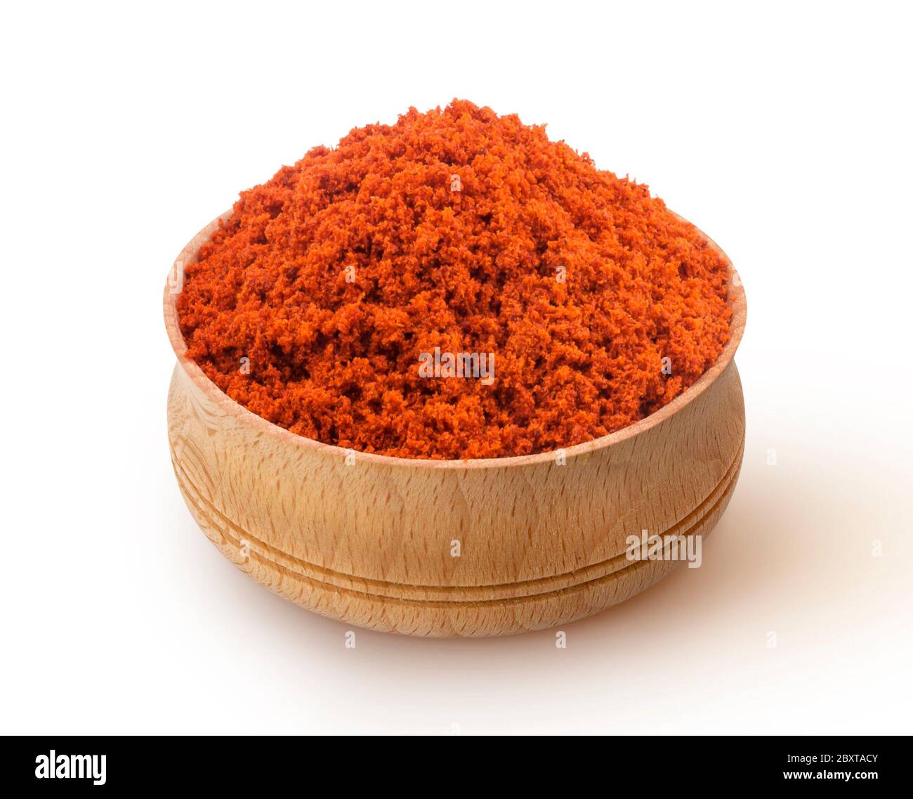 Red paprika powder in wooden bowl isolated on white background Stock ...