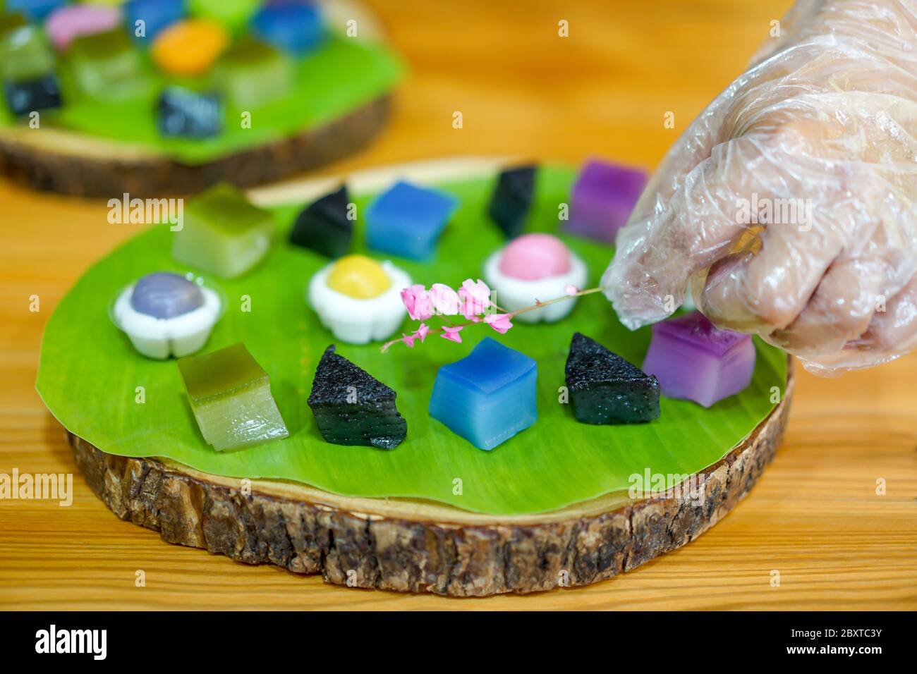 Thai Chef's hand is decorating Varieties traditional colorful Thai ...