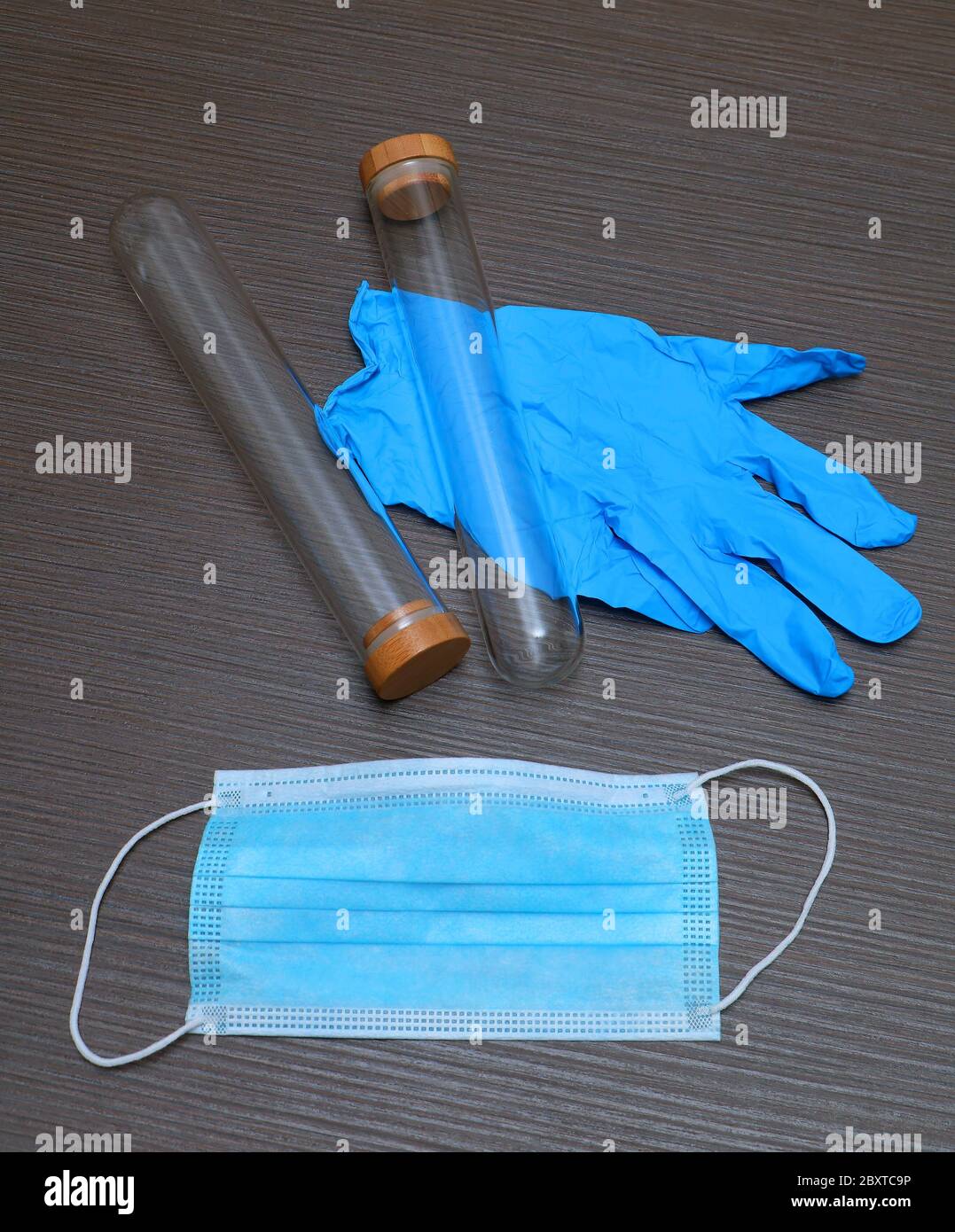 Face mask and gloves with test tubes used in laboratory research Stock ...