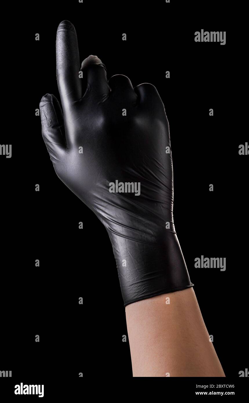 Hand in black gloves with the index finger pointing up on black Stock ...