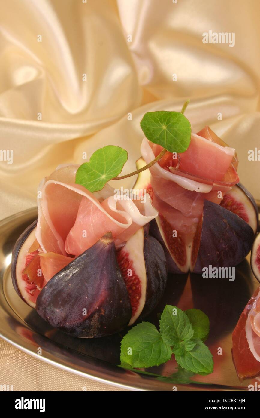 Figs with Serrano ham Stock Photo - Alamy