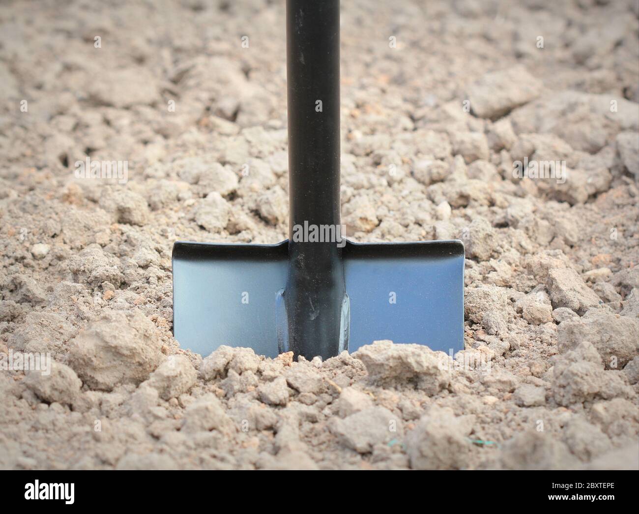 Digging spring soil with shovel. Close-up Stock Photo - Alamy