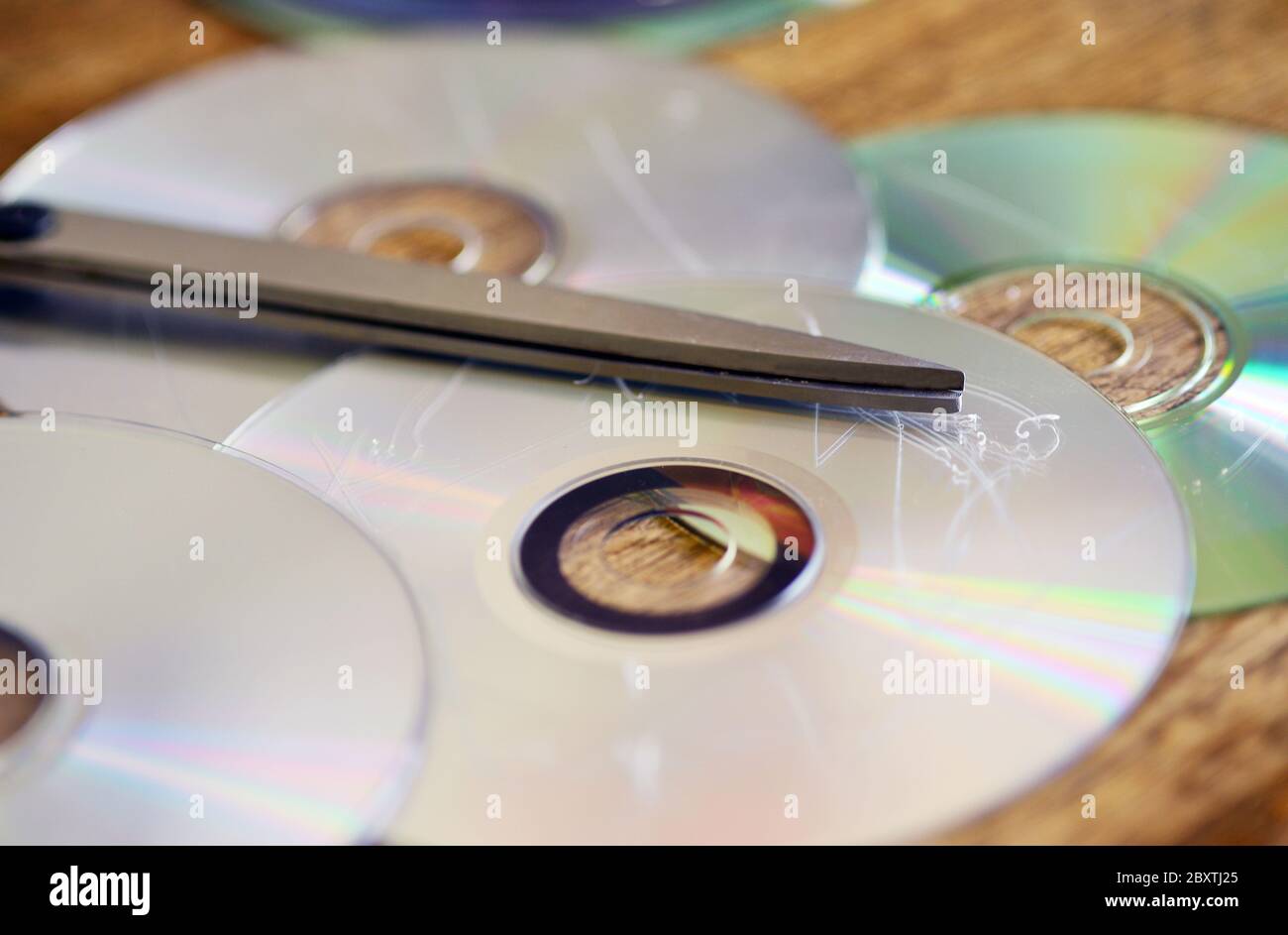 Vintage data disc or music discs on a table with scratches on the ...