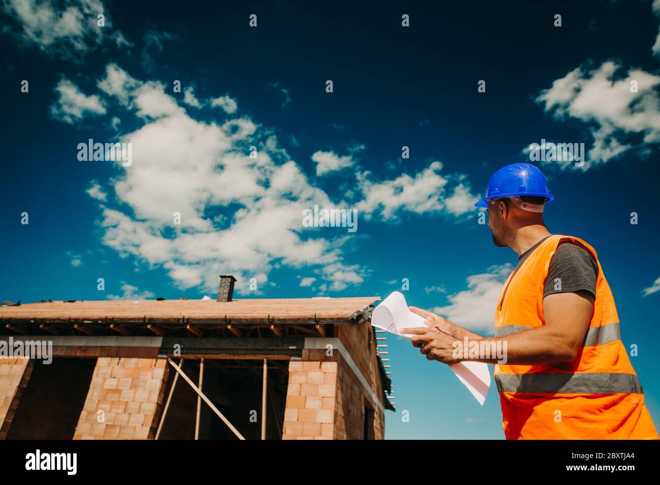 Construction, site manager overseeing construction of the new building ...