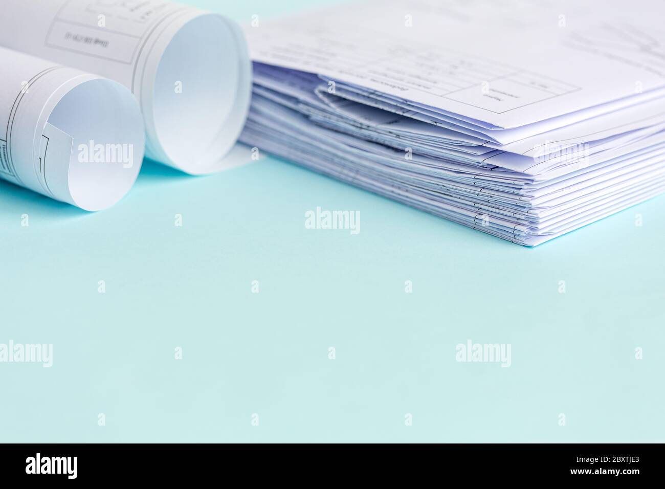 Stack Folding drawings on a blue background. Top view. Flat lay. Copy ...