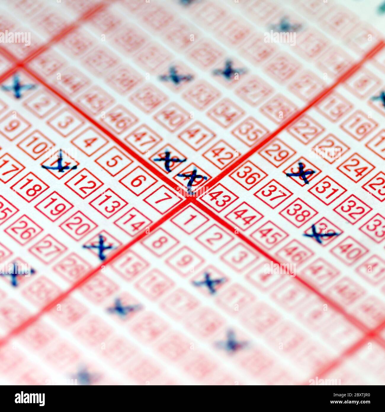 Lottery ticket checked Stock Photo - Alamy