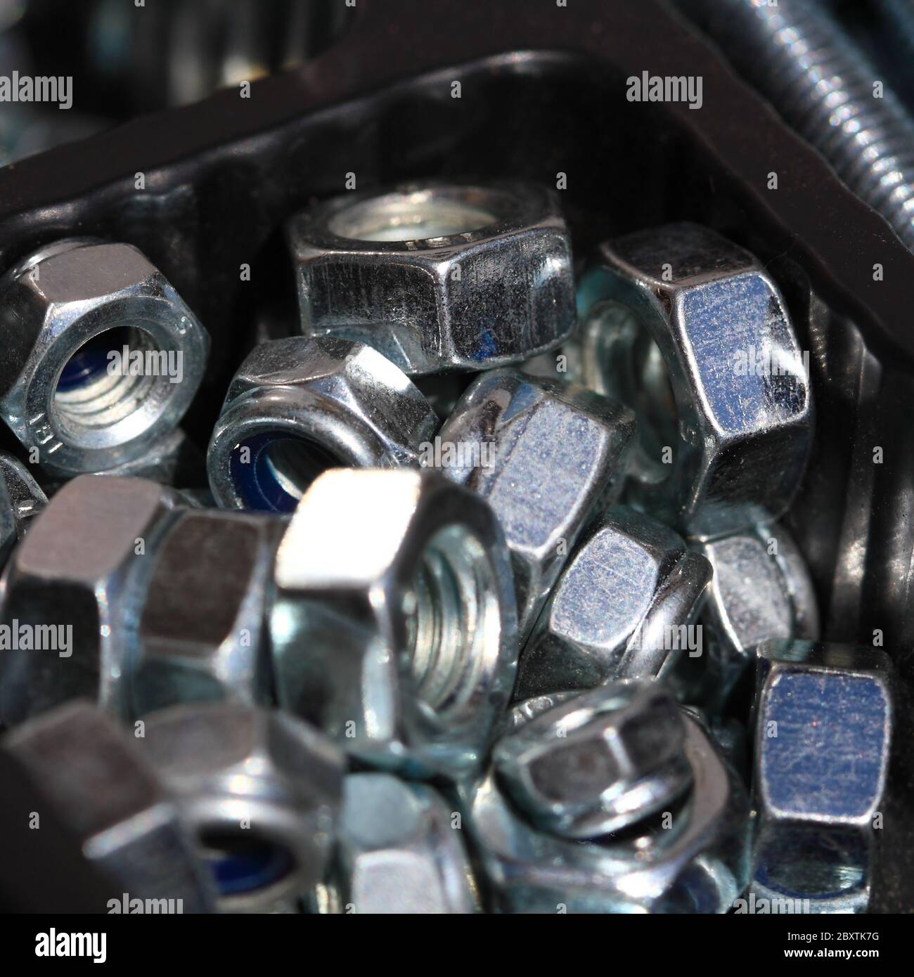 Hex nuts in a box Stock Photo - Alamy