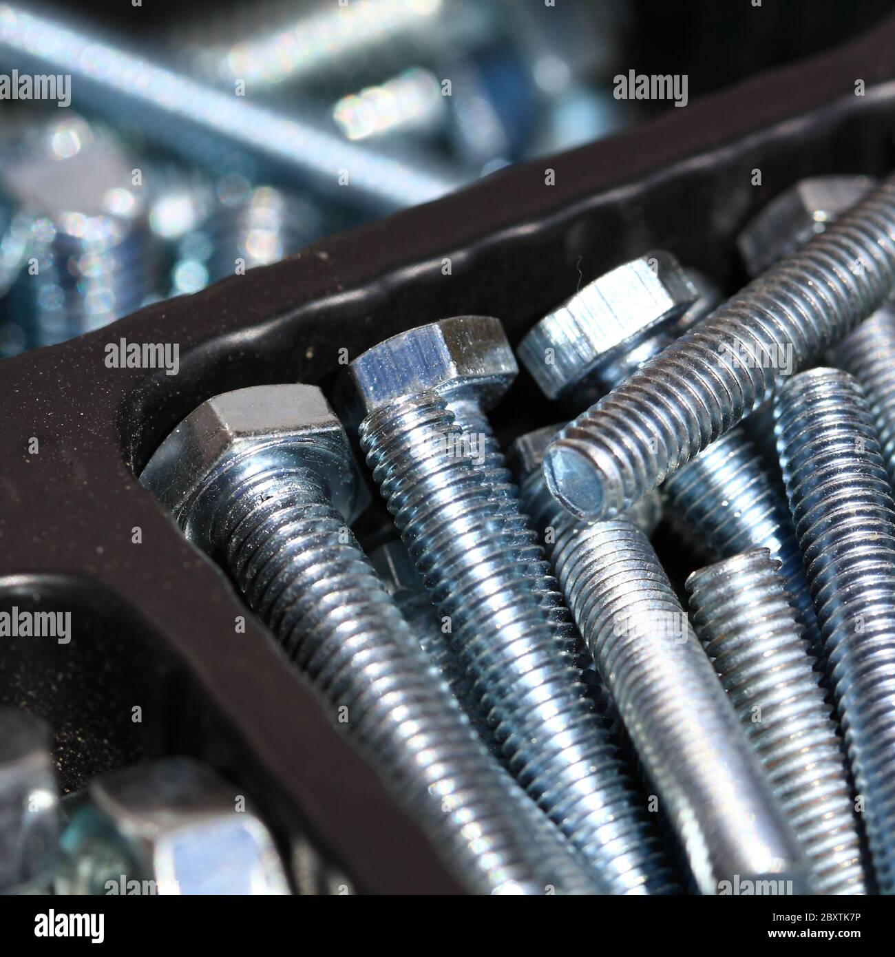 Hex bolts in a box Stock Photo - Alamy