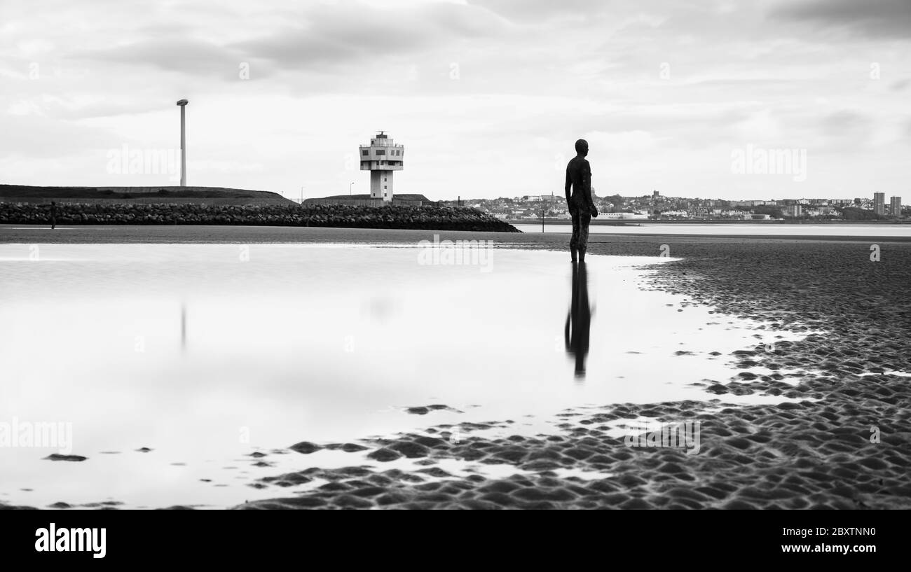 One of the one hundred Iron Men (created by Antony Gormley) captured on ...