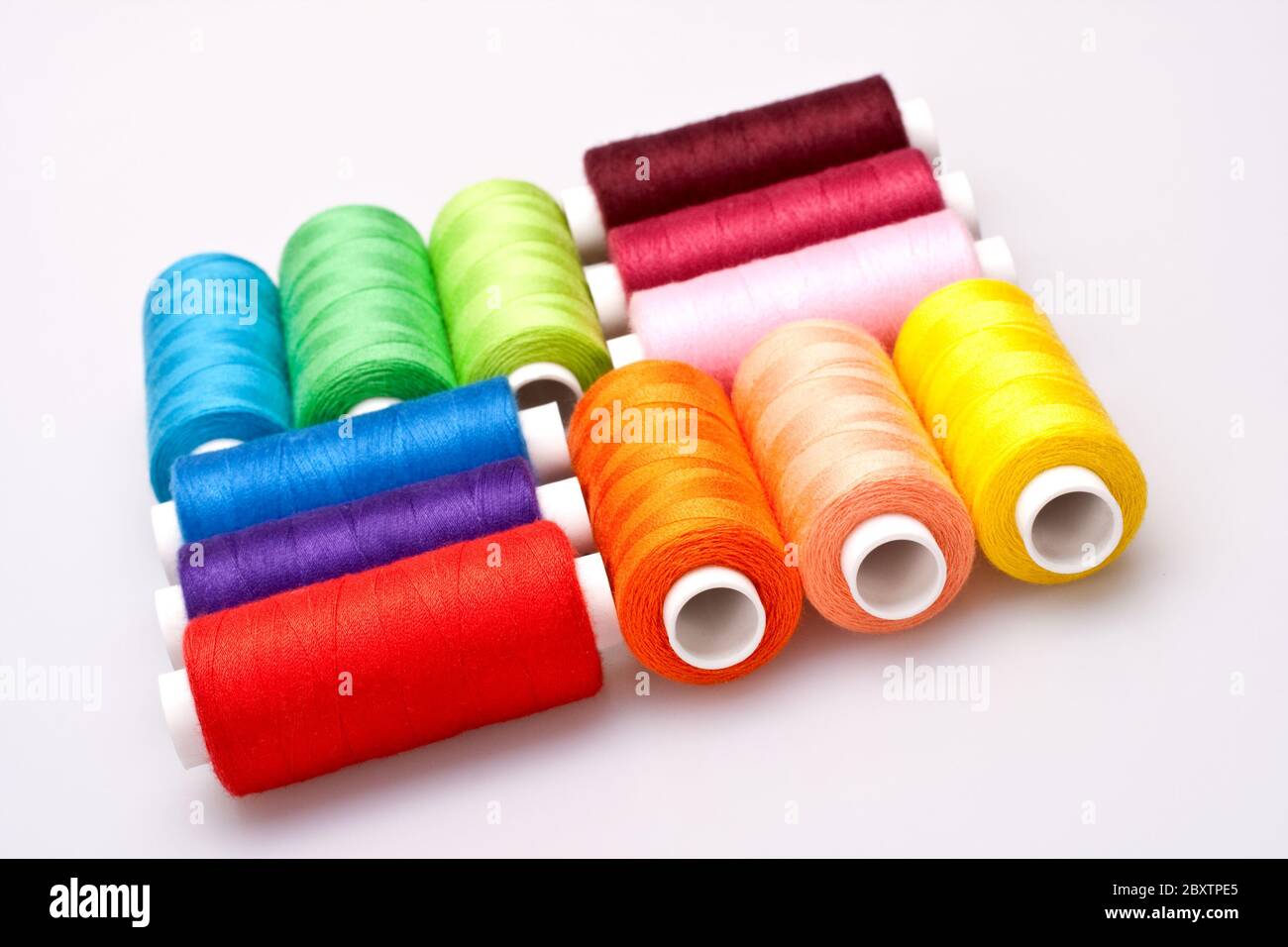 colored thread for sewing Stock Photo - Alamy