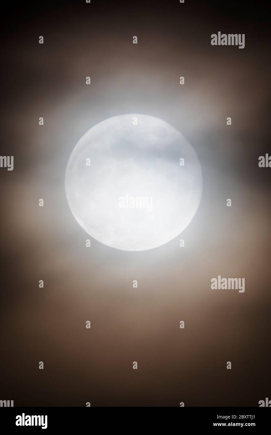 Full moon through clouds hi-res stock photography and images - Alamy