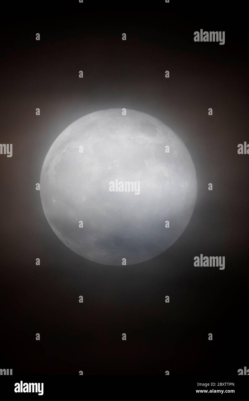 Full moon through clouds hi-res stock photography and images - Alamy