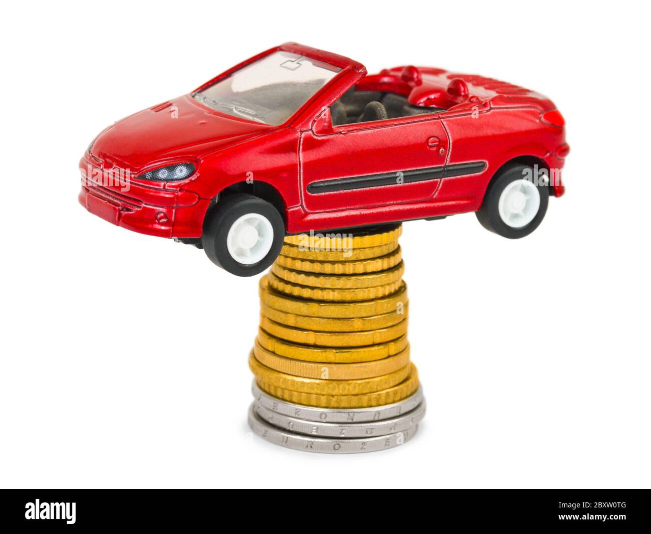 Toy car and stack of coins Stock Photo - Alamy