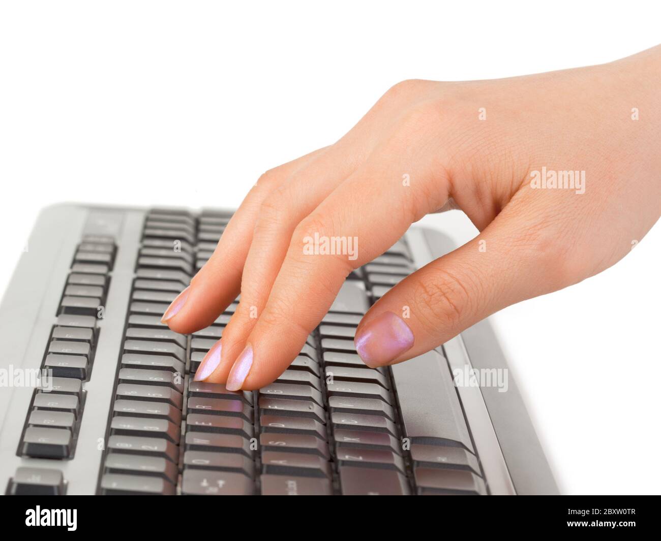 Computer keyboard and hand Stock Photo - Alamy
