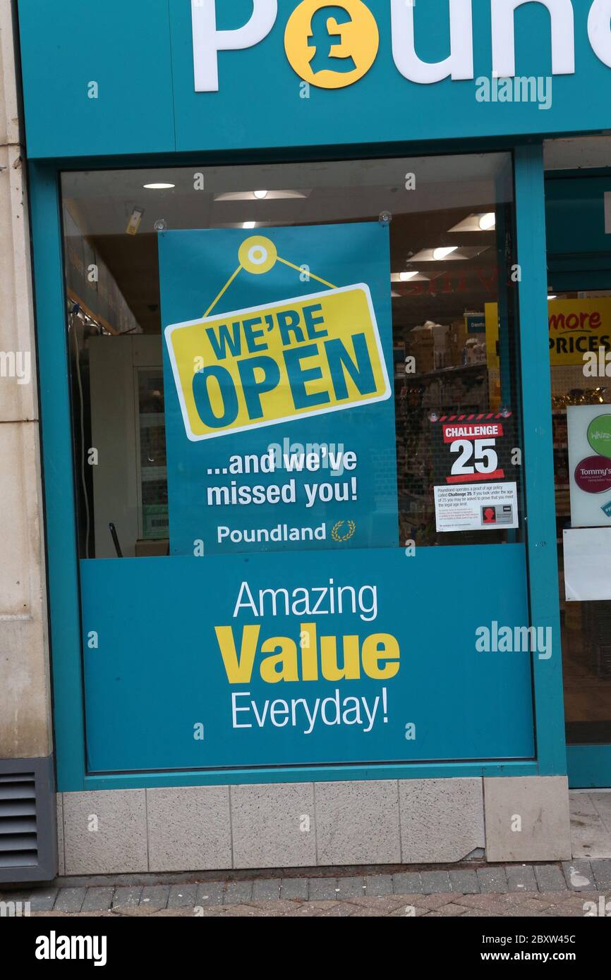 retail shop sign advertising that it is open during the Covid pandemic ...
