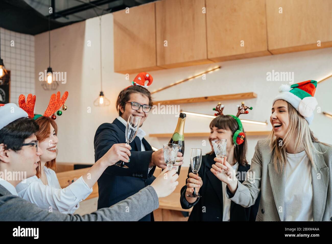Happy colleagues in office celebrate special event Stock Photo - Alamy