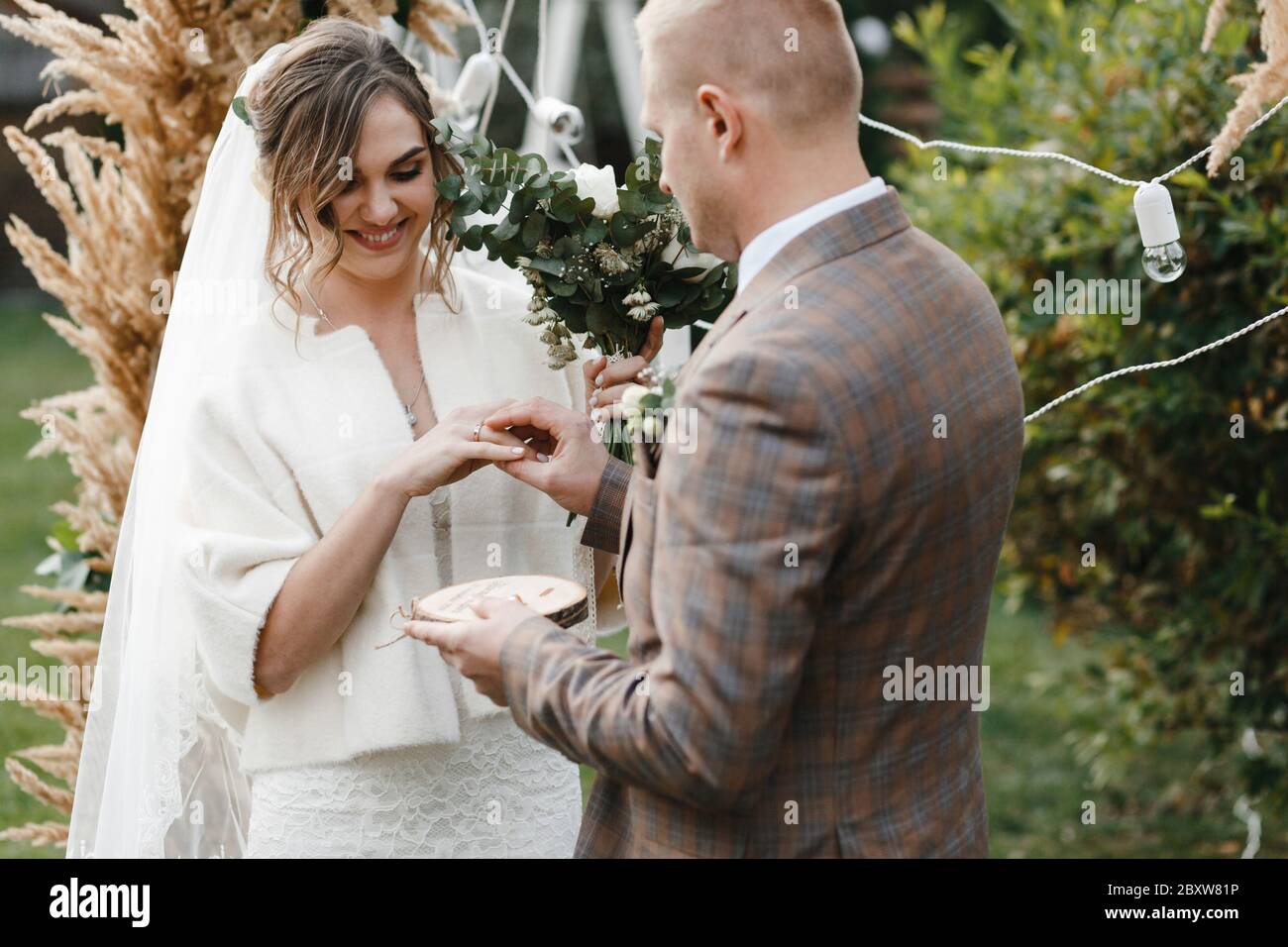 Bride finger groom putting ring hi-res stock photography and images - Alamy
