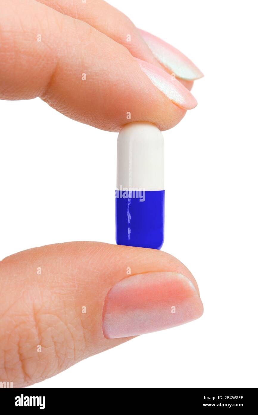 Hand and pill Stock Photo - Alamy