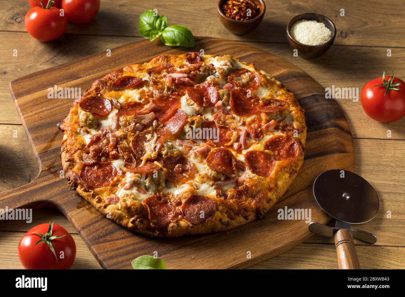 Savory Homemade Meat Lovers Pizza with Pepperoni and Bacon Stock Photo ...