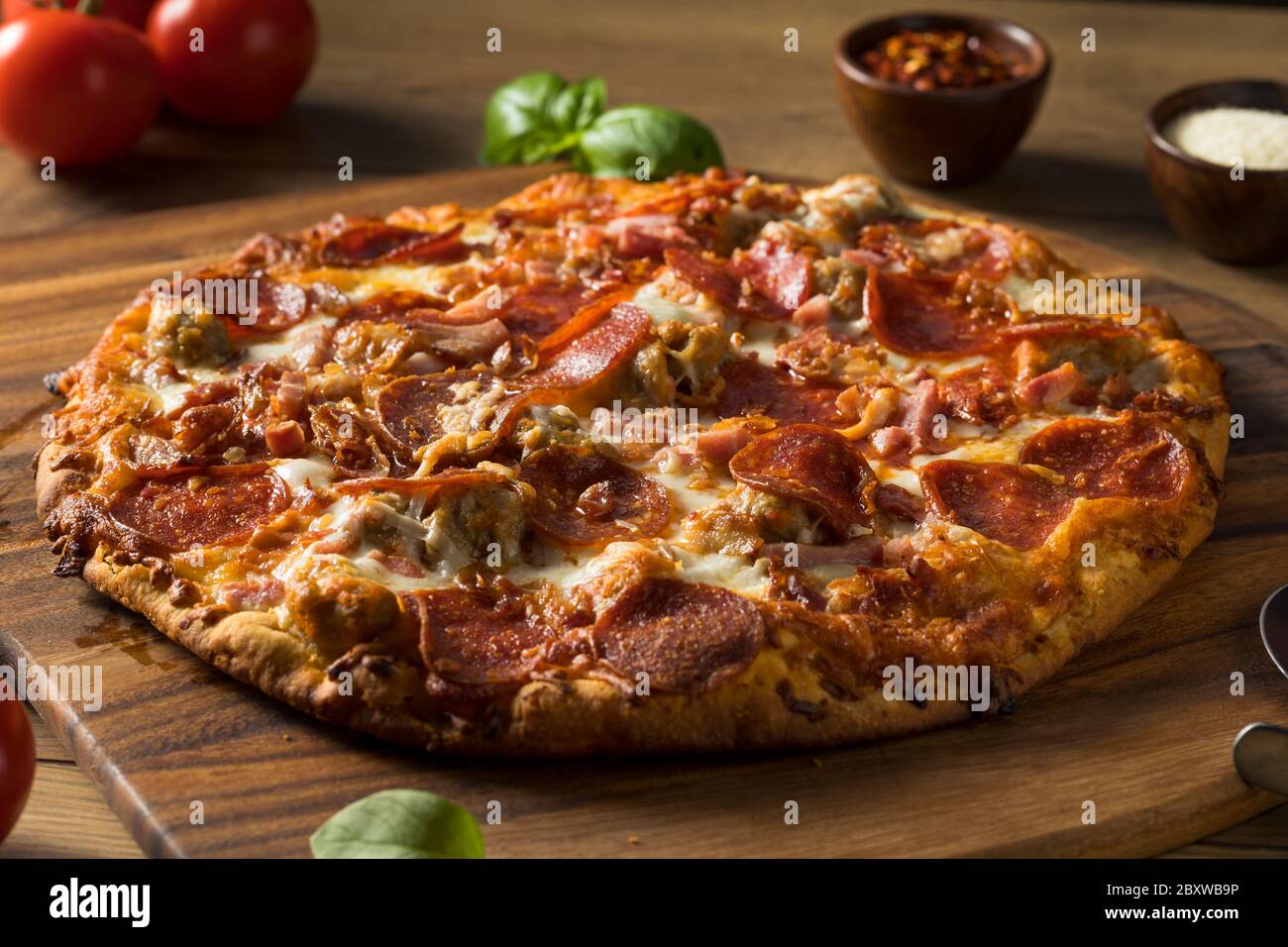 Savory Homemade Meat Lovers Pizza with Pepperoni and Bacon Stock Photo ...