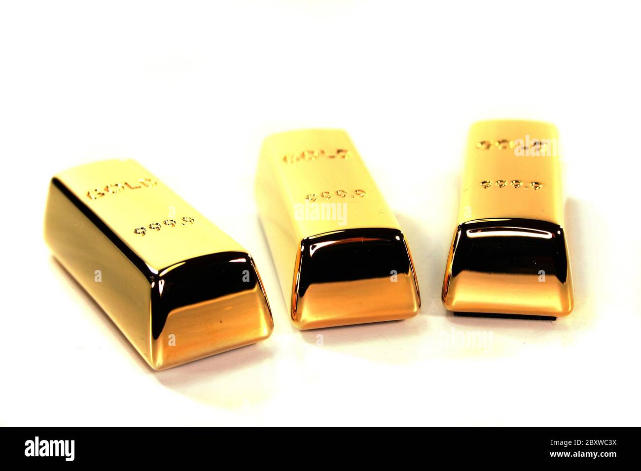 three gold bars Stock Photo - Alamy