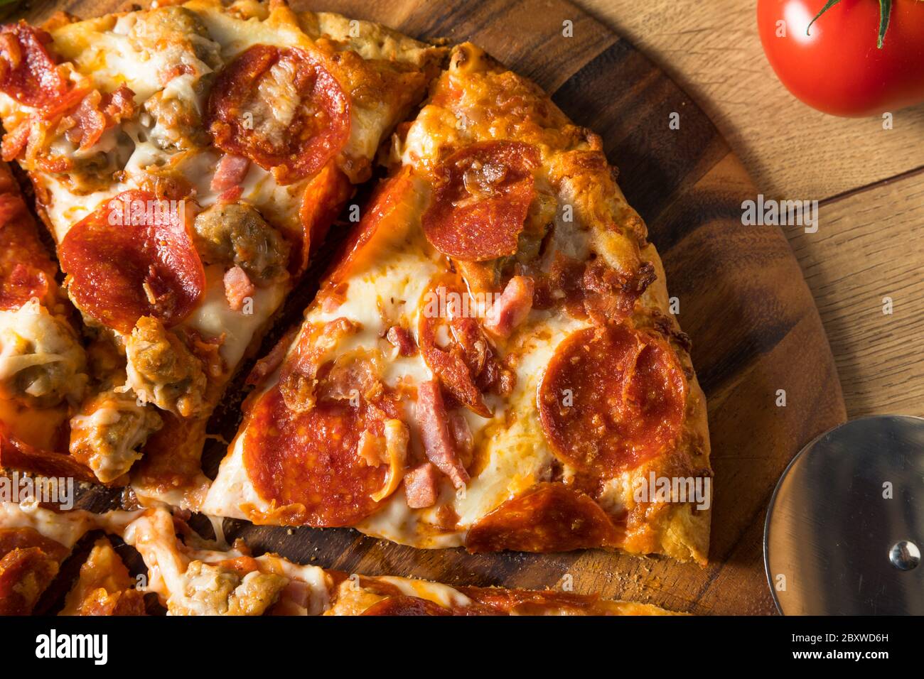Savory Homemade Meat Lovers Pizza with Pepperoni and Bacon Stock Photo ...