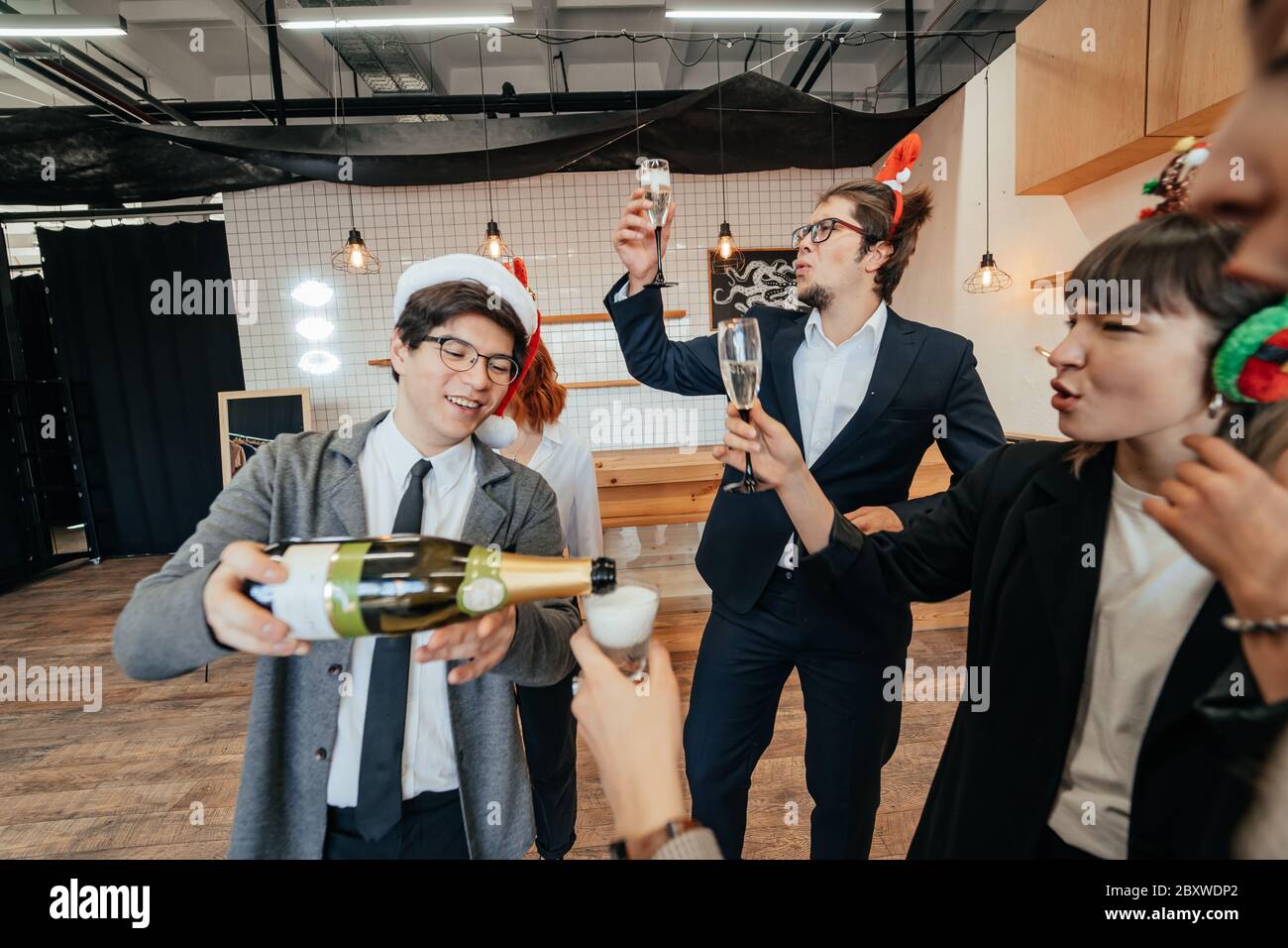 Happy colleagues in office celebrate special event Stock Photo - Alamy