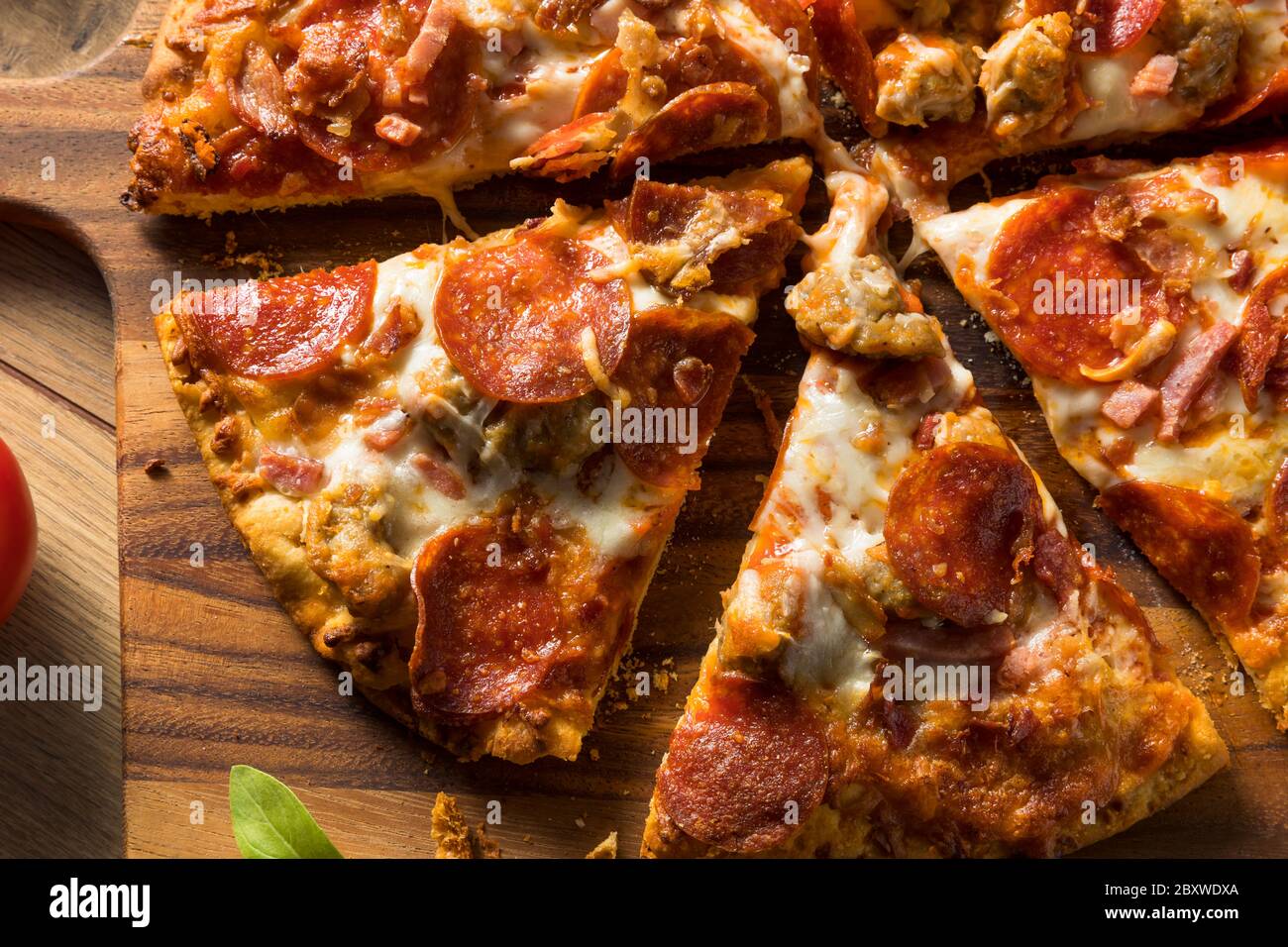 Savory Homemade Meat Lovers Pizza with Pepperoni and Bacon Stock Photo ...