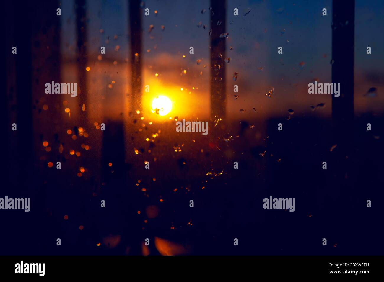 rain drops on the glass ,view of sunset sunbeam through the window ...