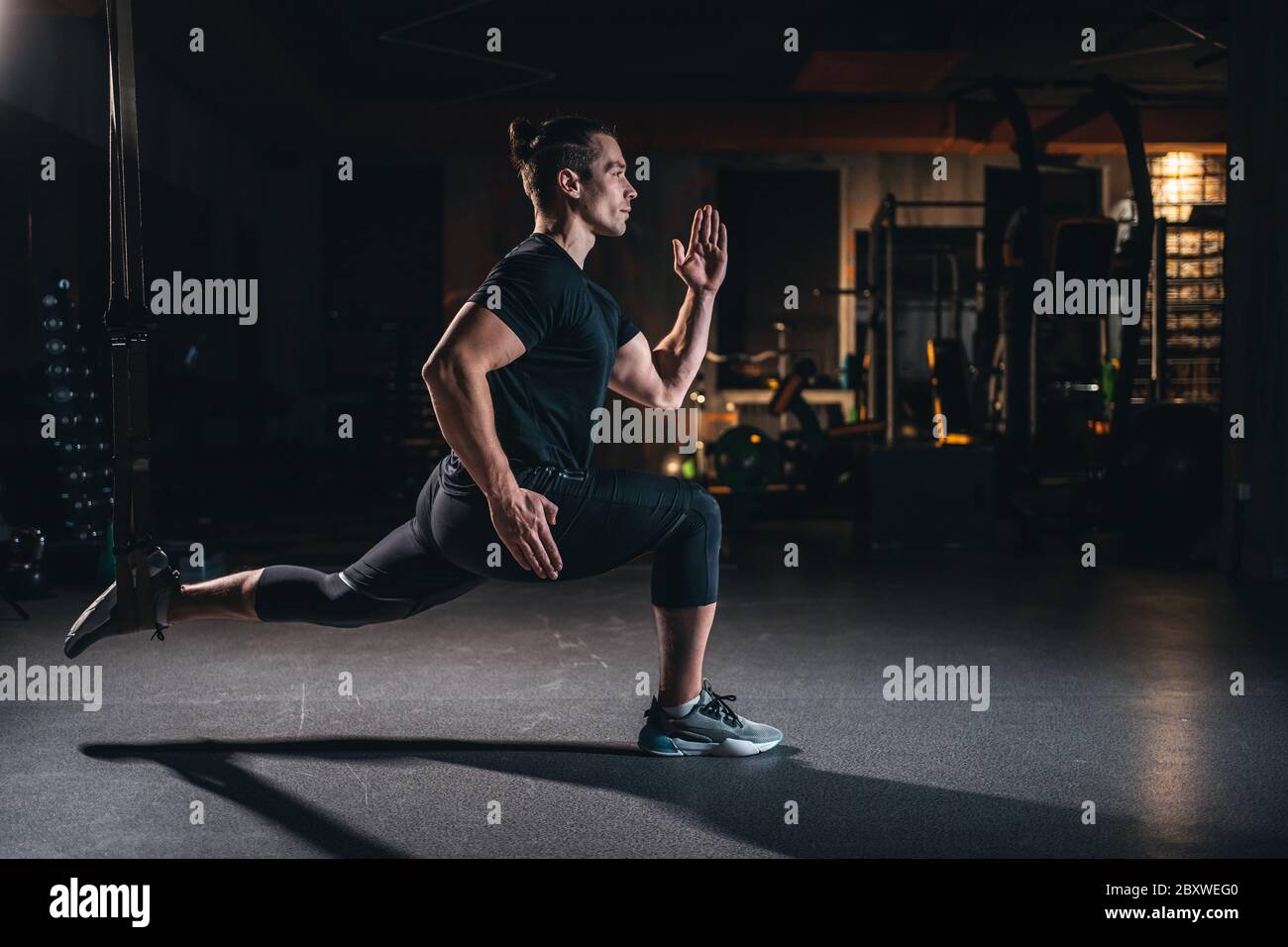 handsome male training with professional equipment in sport club Stock ...