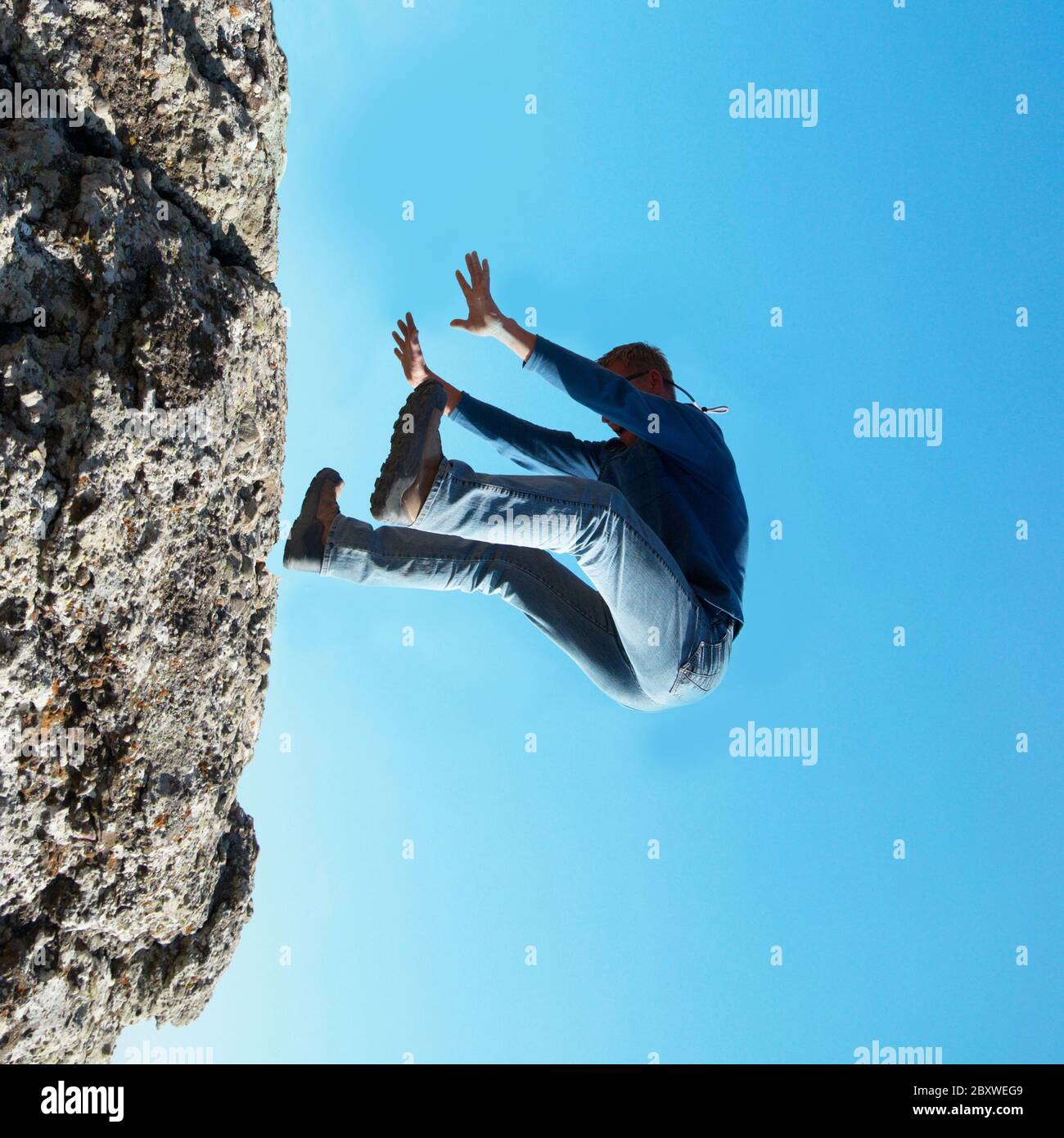Falling down man Stock Photo - Alamy