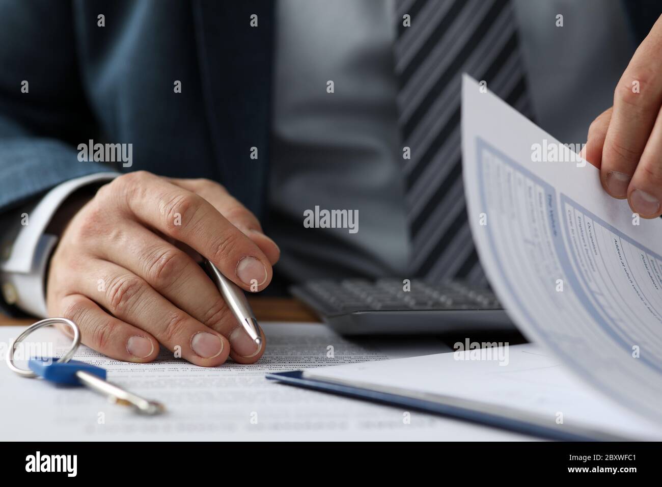 Man in presentable grey suit Stock Photo - Alamy