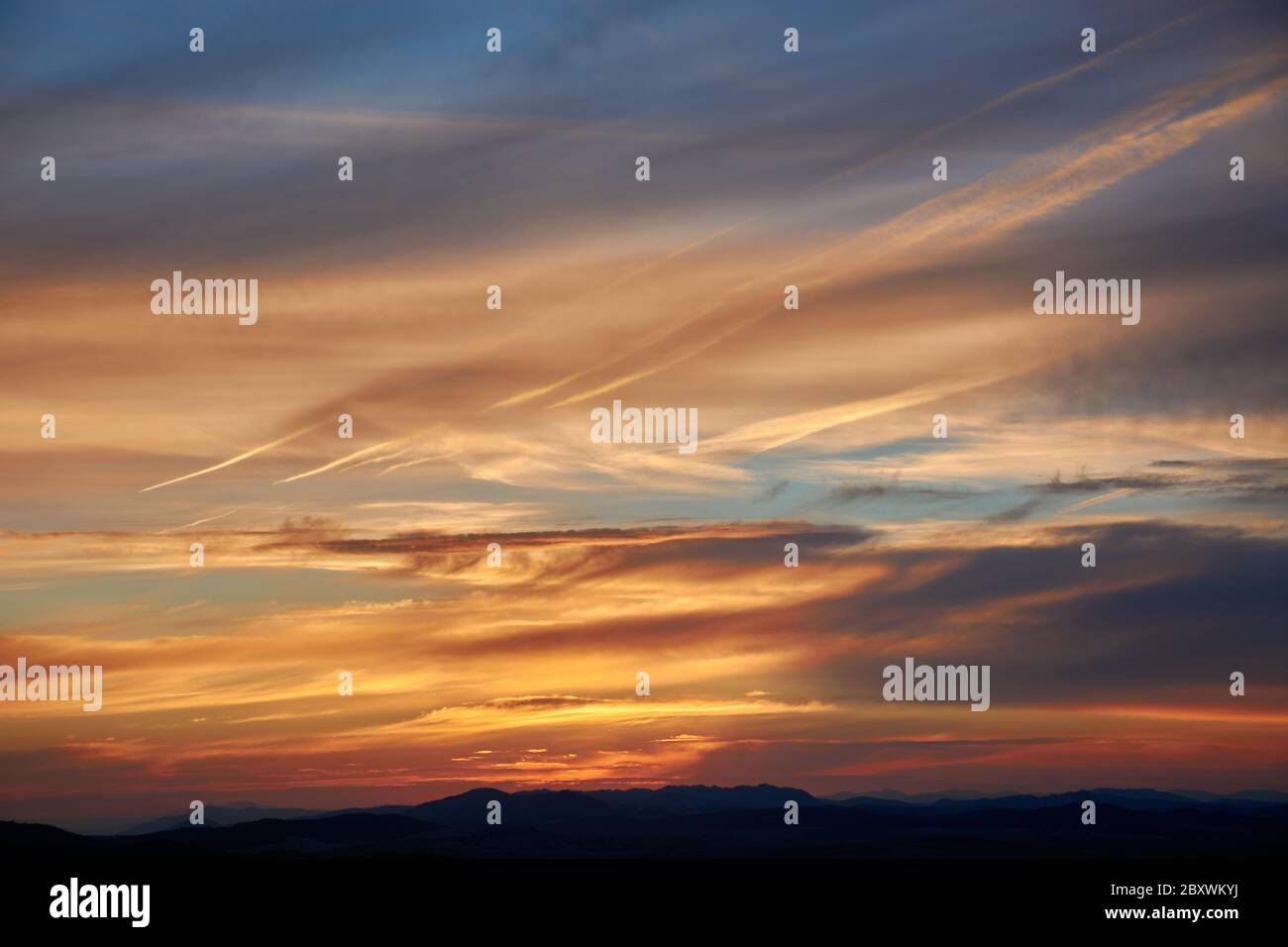 A stunning sunset with golden and purple undertones Stock Photo - Alamy
