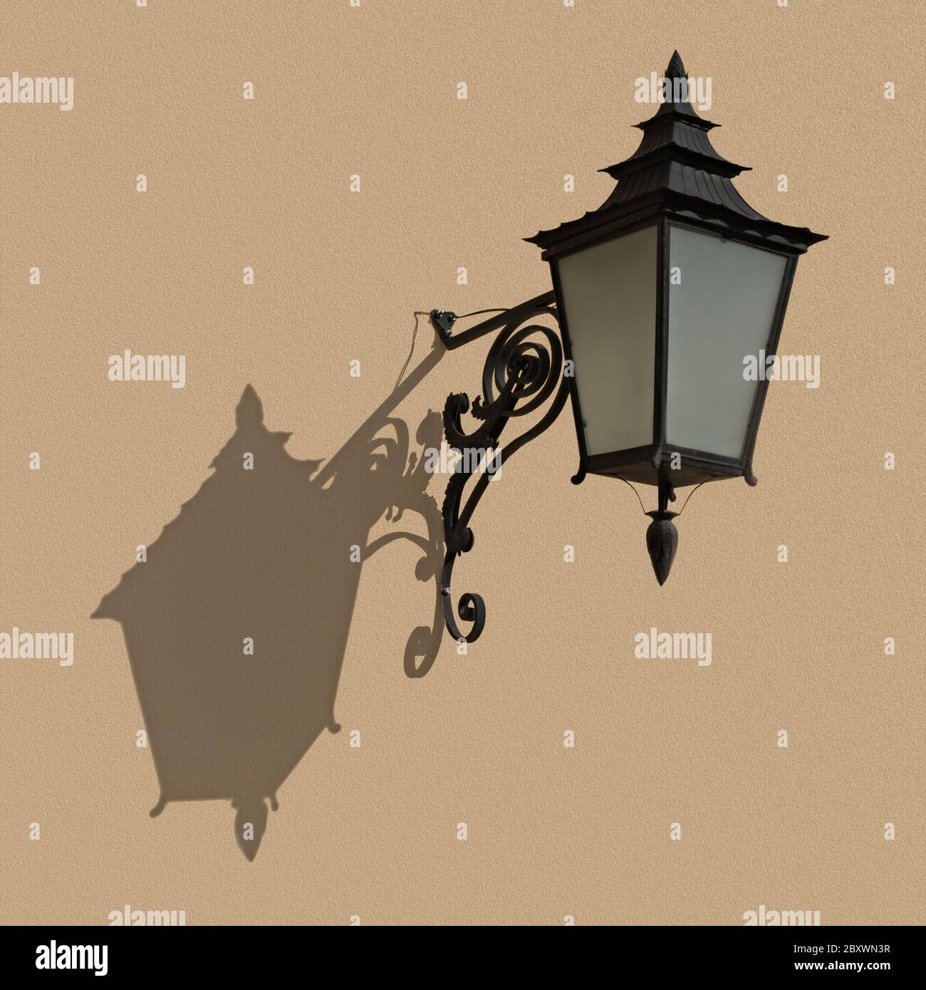An old-fashioned lantern hanging on a wall Stock Photo - Alamy