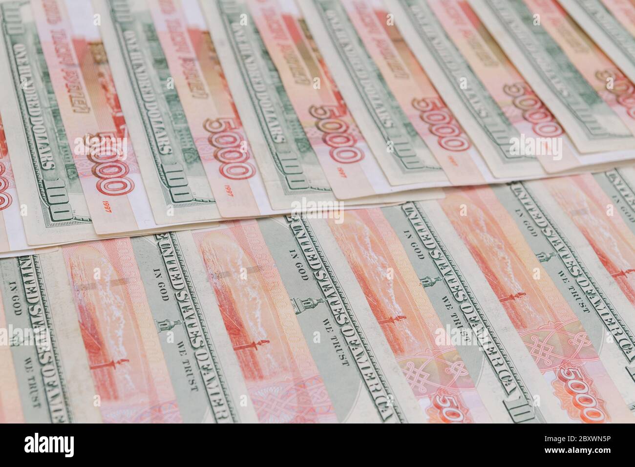 A large number of American hundred dollar bills and Russian five ...