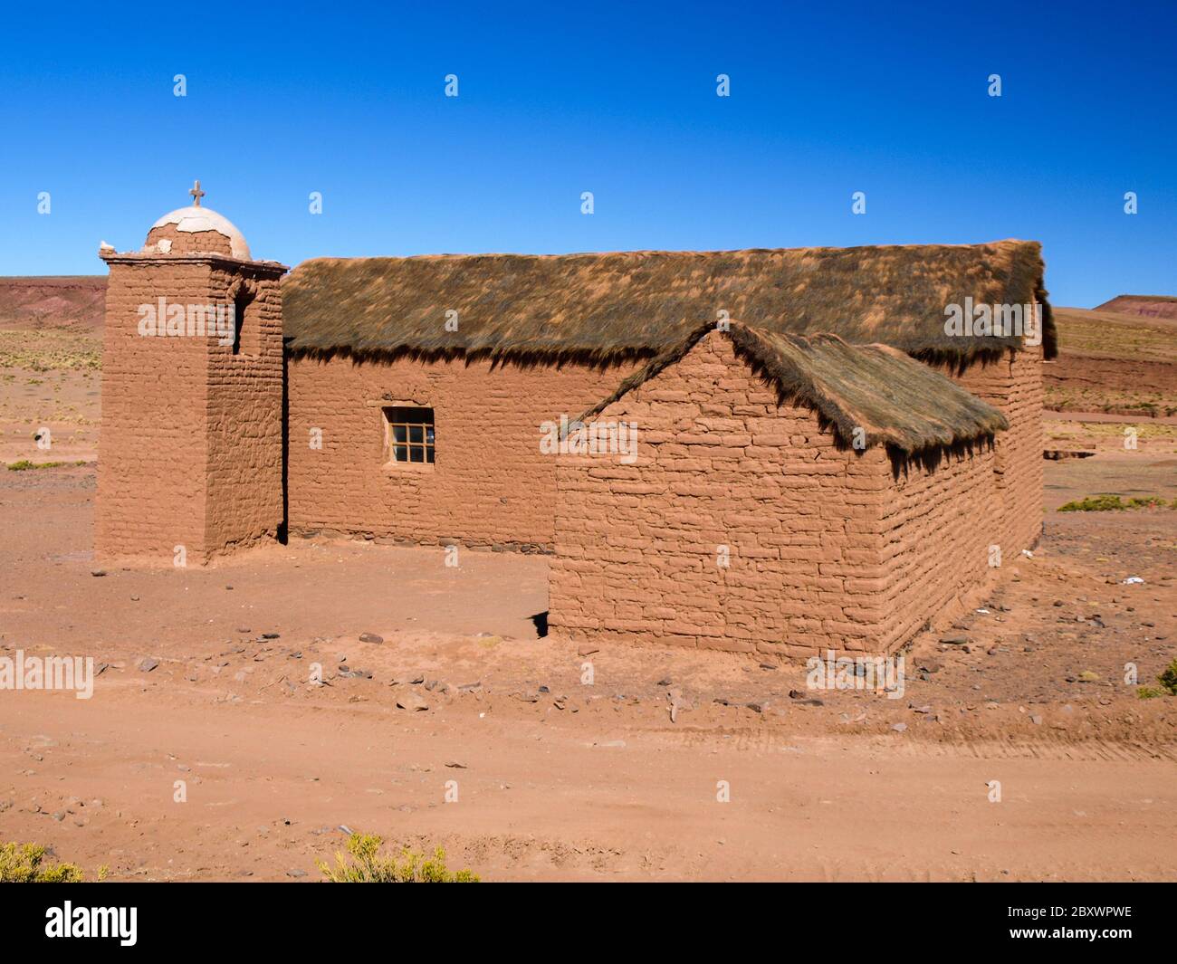 Small rural andean style church made of unfired clay bricks, Cordillera ...