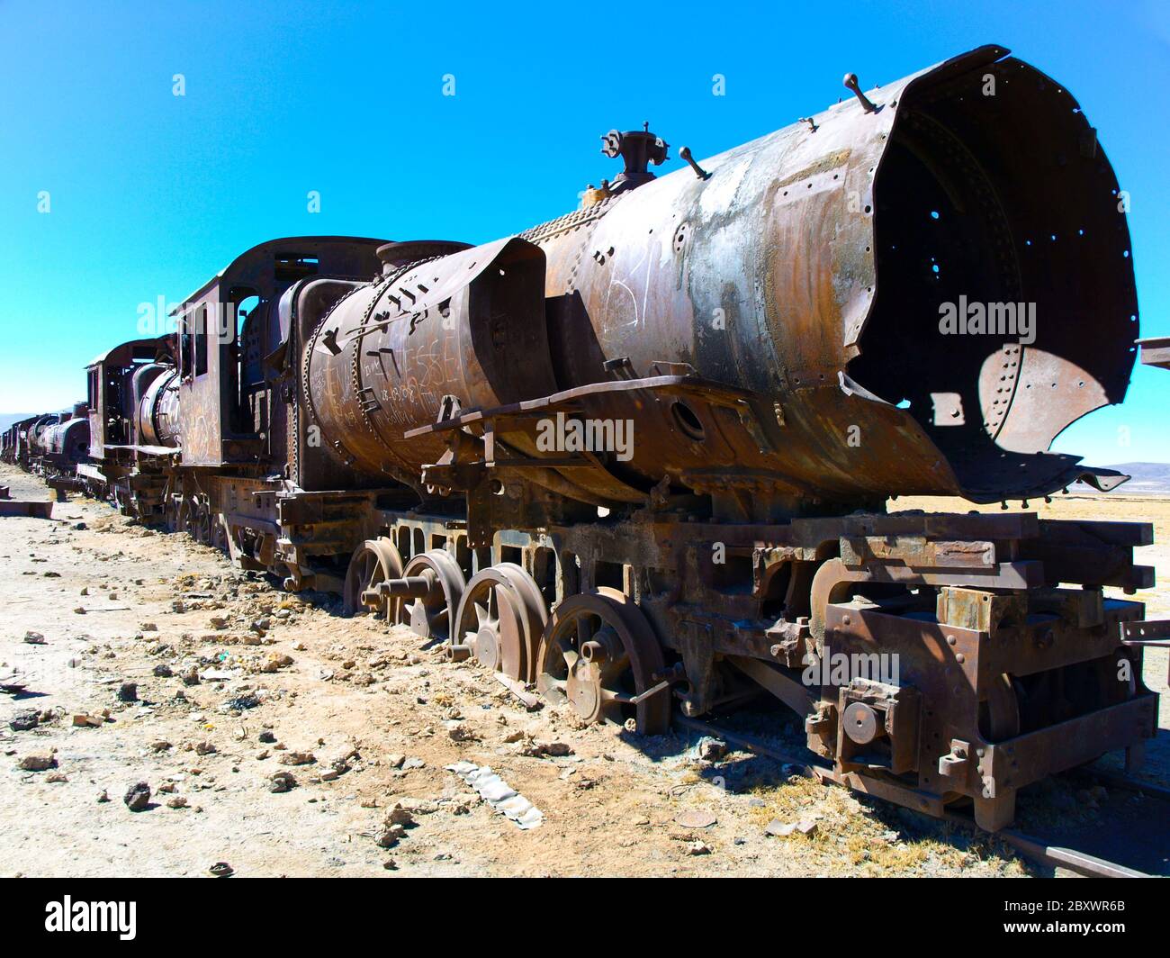 Old rusty steam locomotive in train cemetery or cementerio de trenes ...