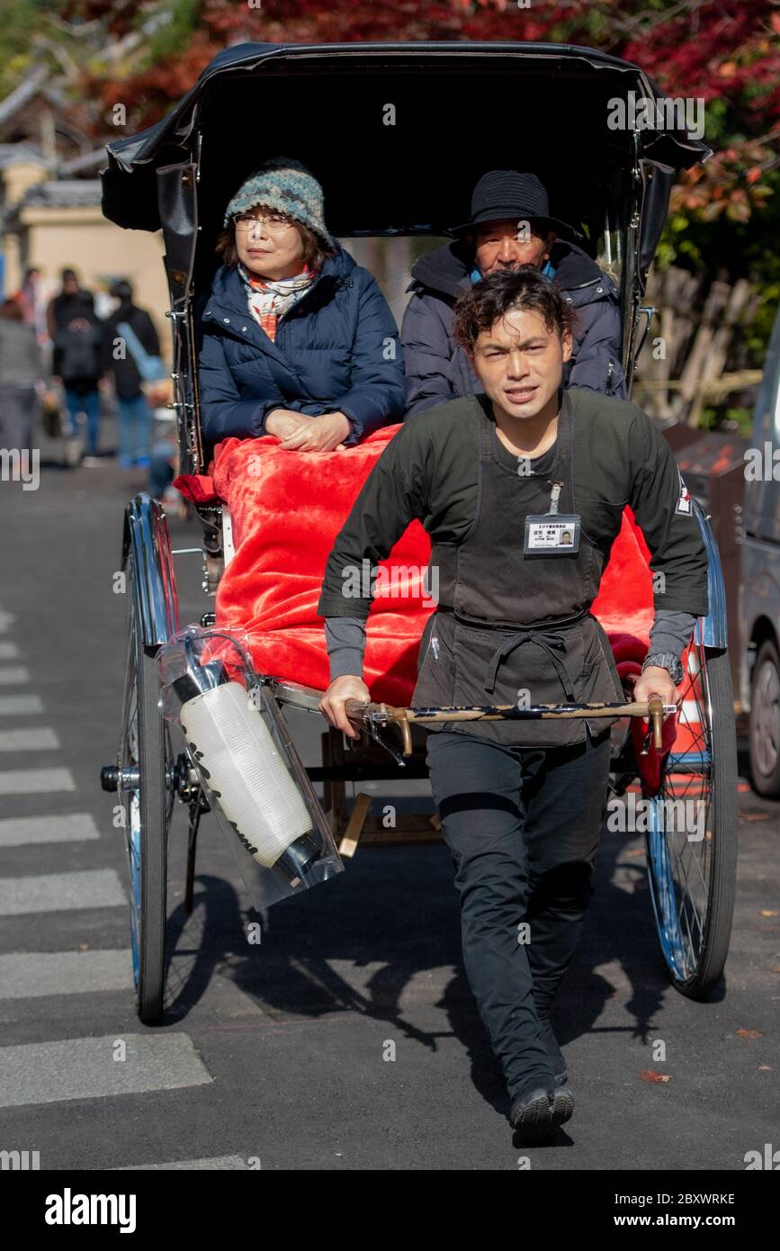 Hand pulling rickshaw hi-res stock photography and images - Alamy