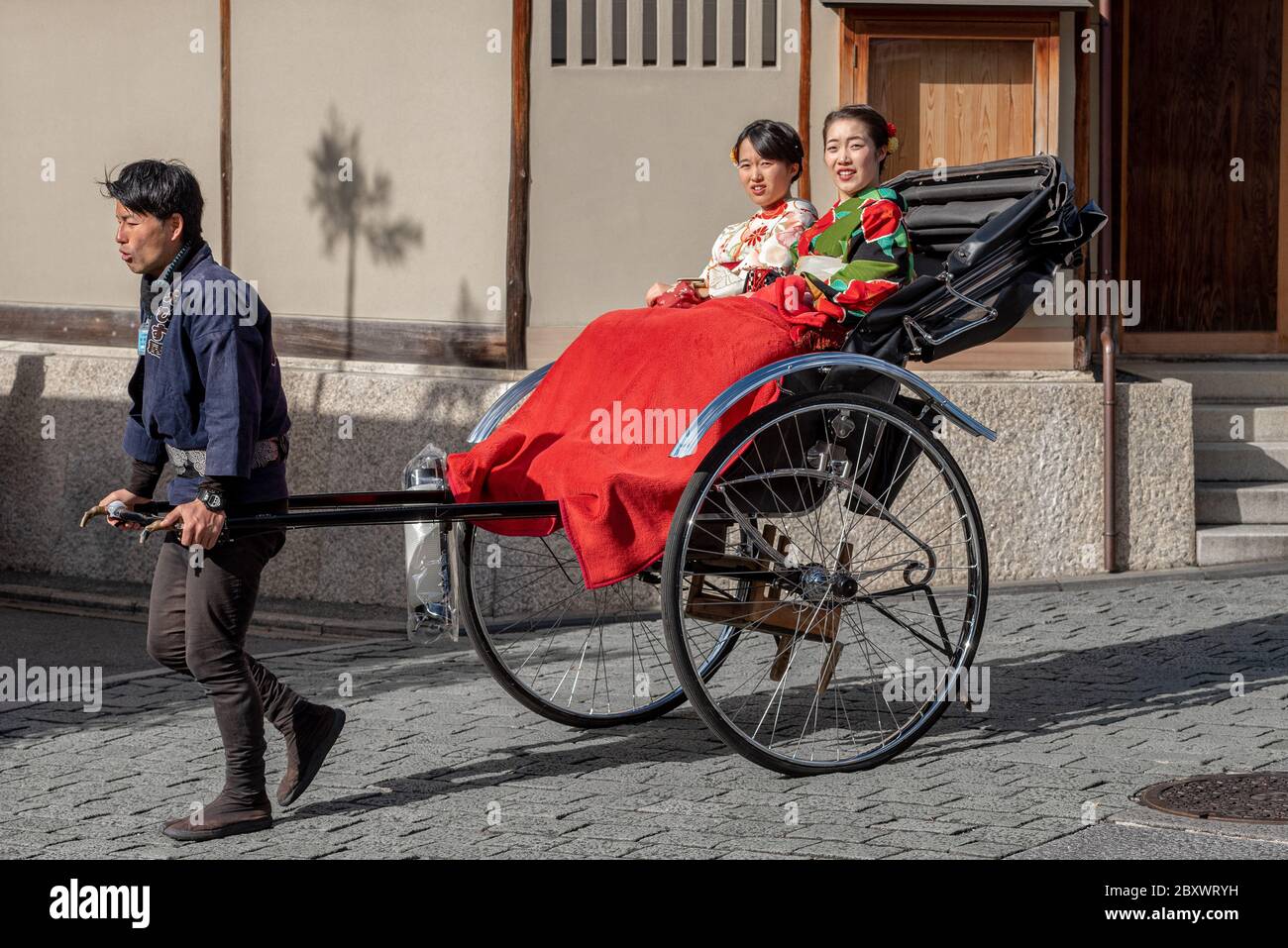 Hand pulling rickshaw hi-res stock photography and images - Alamy