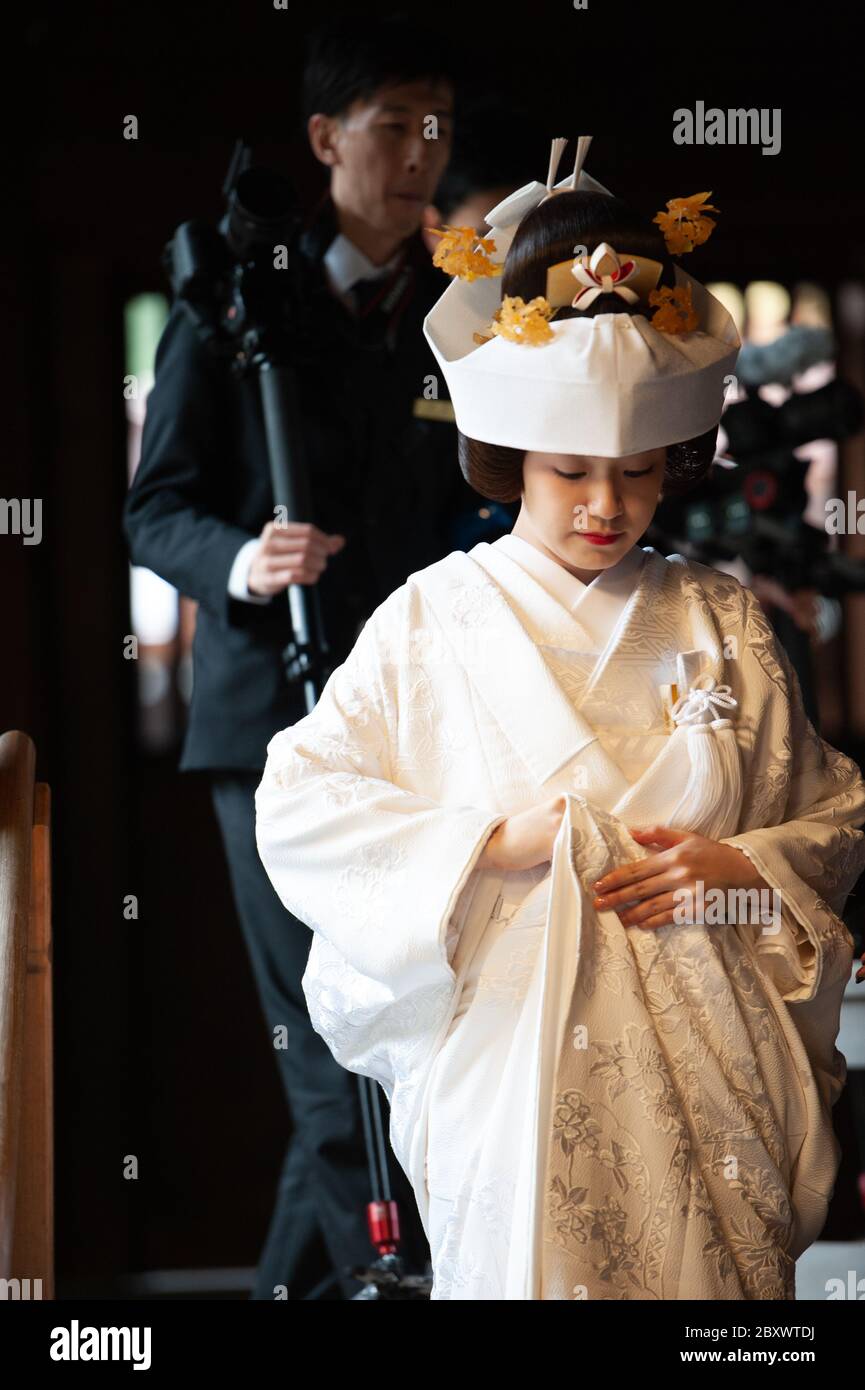 A Japanese Bride is taking wedding photos at the Meiji Shrine in Tokyo ...
