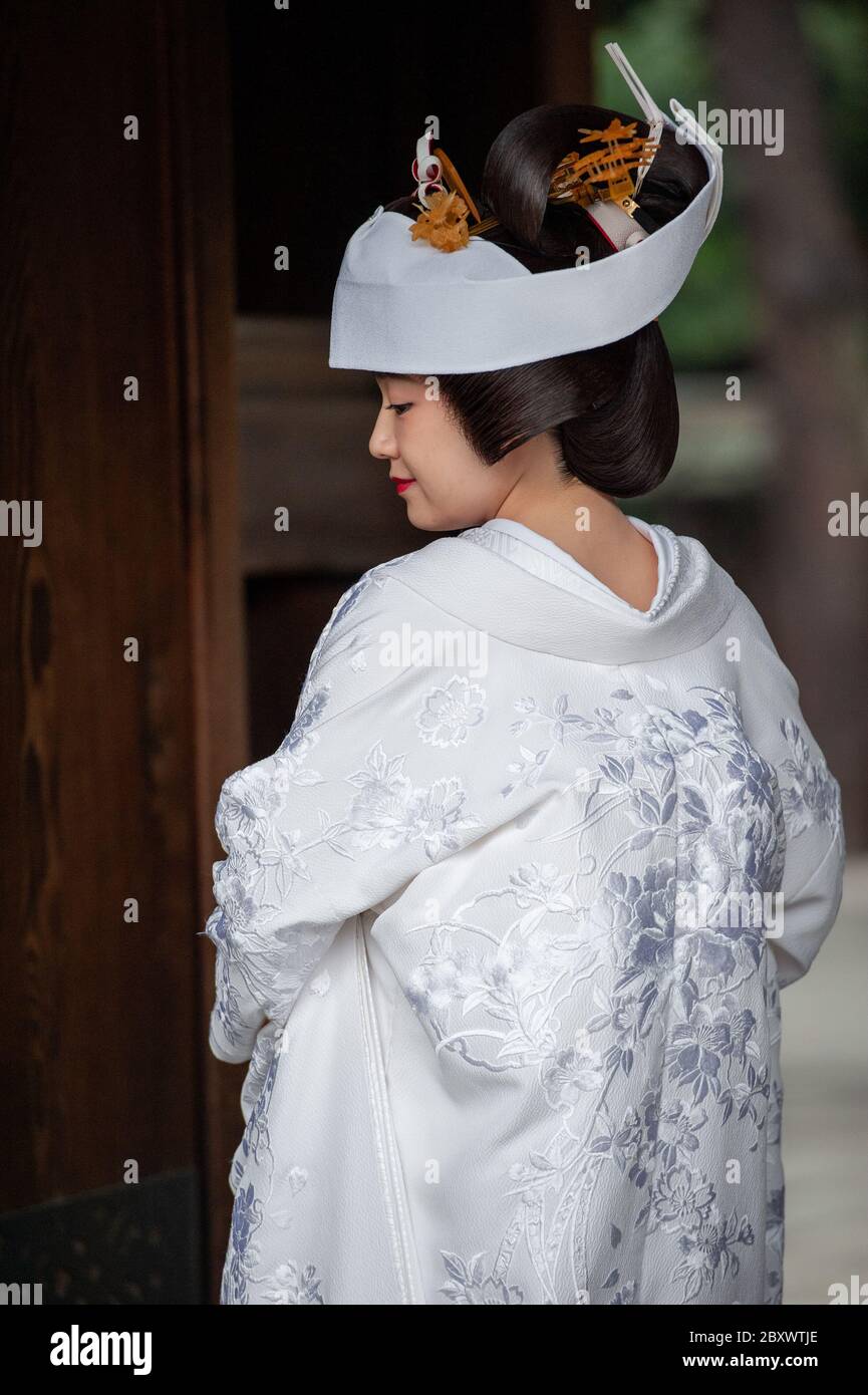 Japanese bride wearing traditional kimono and headdress just before the ...
