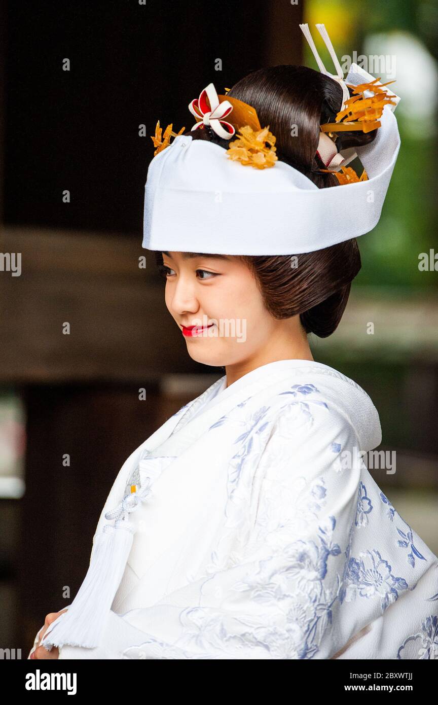 Japanese Bride Wearing Traditional Kimono And Headdress Just Before The