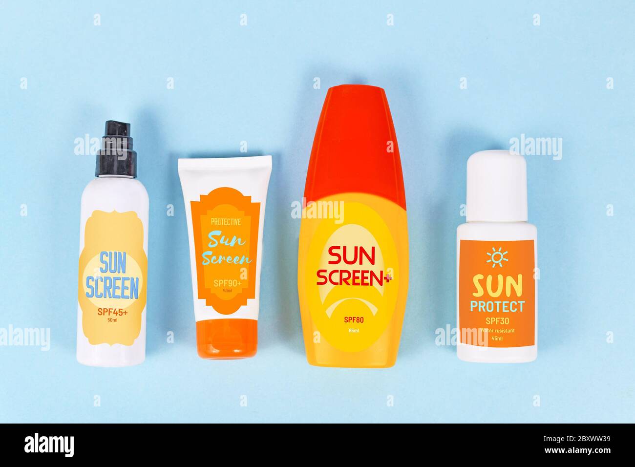 Various protective sun screen bottles and tubes with made up labels on ...