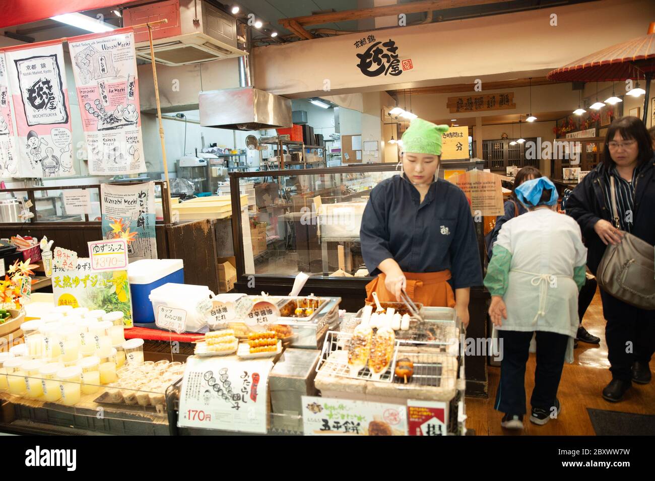 A woman vendor at Nishiki Market also known as Kyotos kitchen selling ...